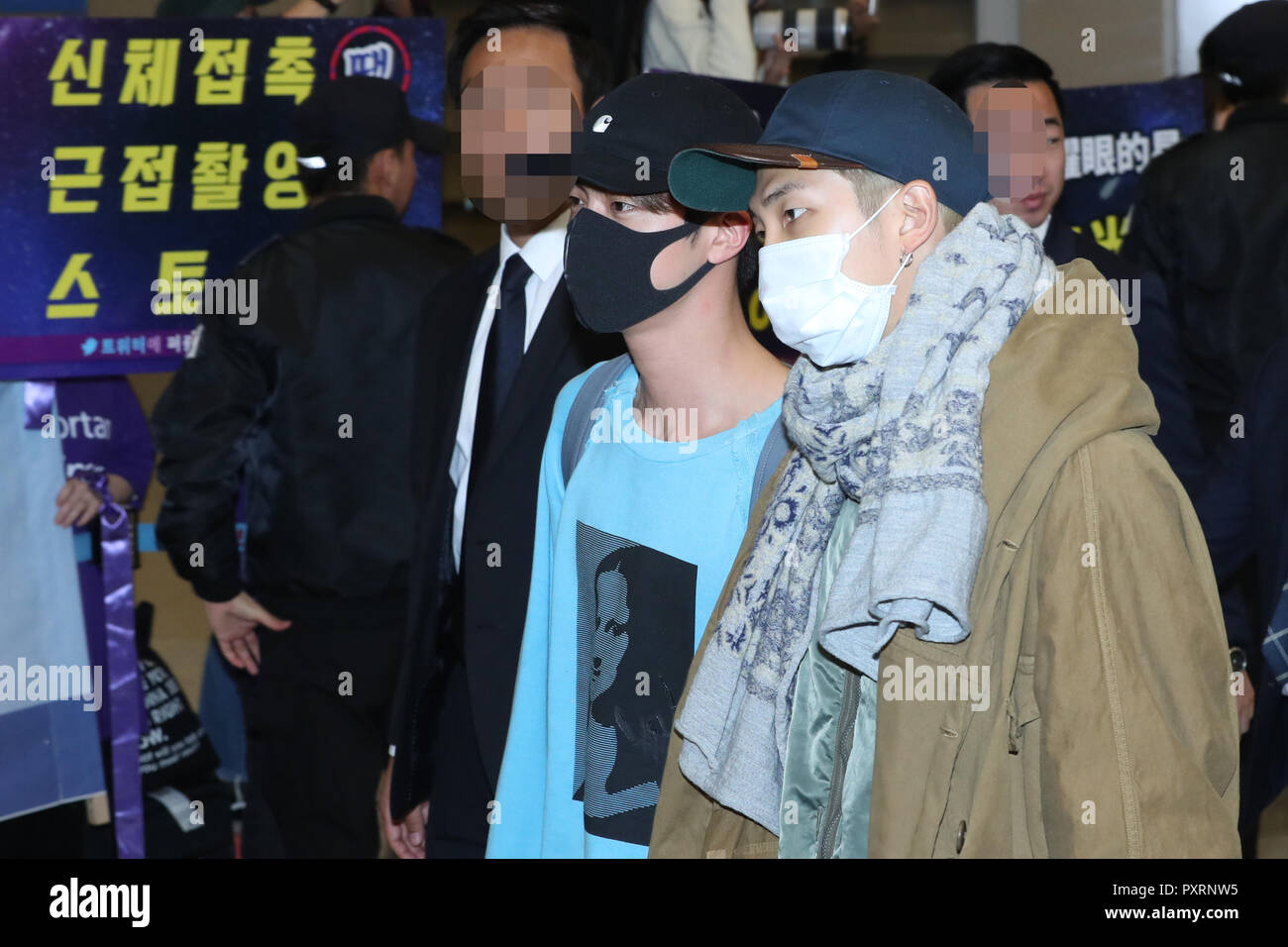 24th Oct, 2018. BTS returns home Masked BTS members Jin (L) and RM ...
