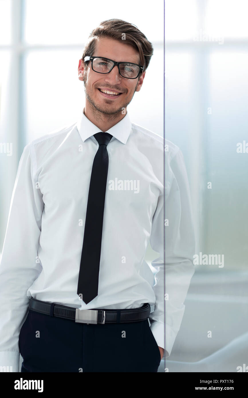 close up.young employee standing in the office Stock Photo - Alamy