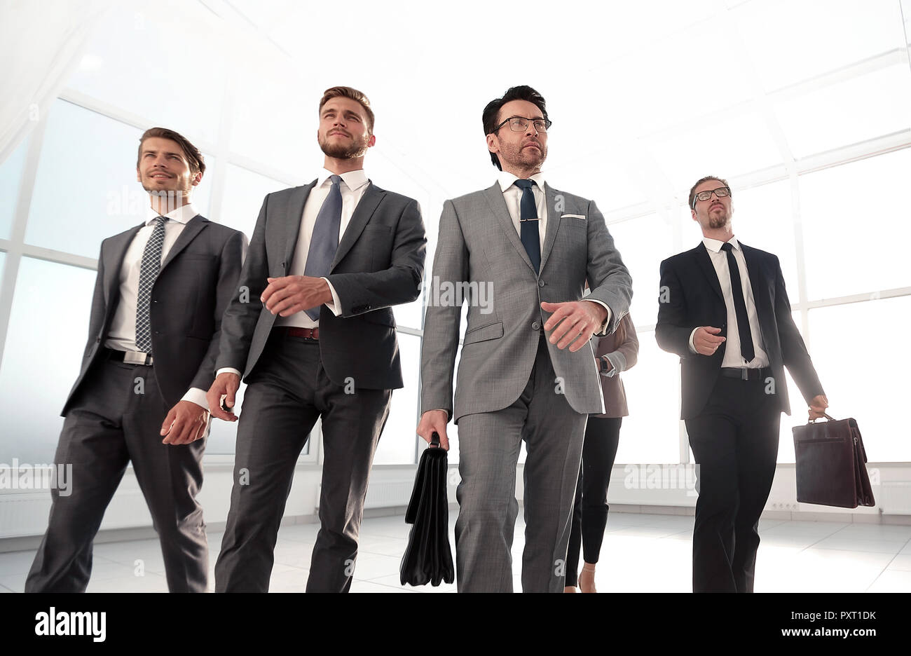 business team, walking at modern office interior Stock Photo - Alamy