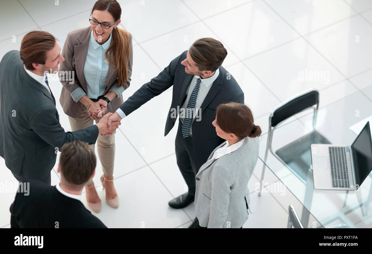top view.handshake trading partners in the office Stock Photo - Alamy