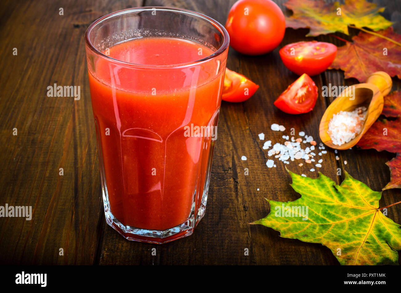 Natural juice with pulp from fresh ripe red tomatoes. Studio Photo ...