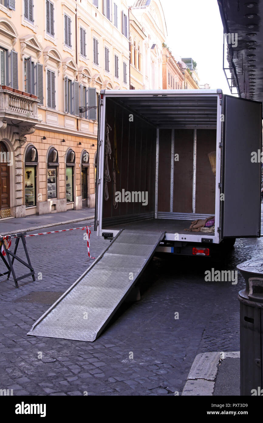 Empty moving truck with loading ramp at Rome street Stock Photo - Alamy