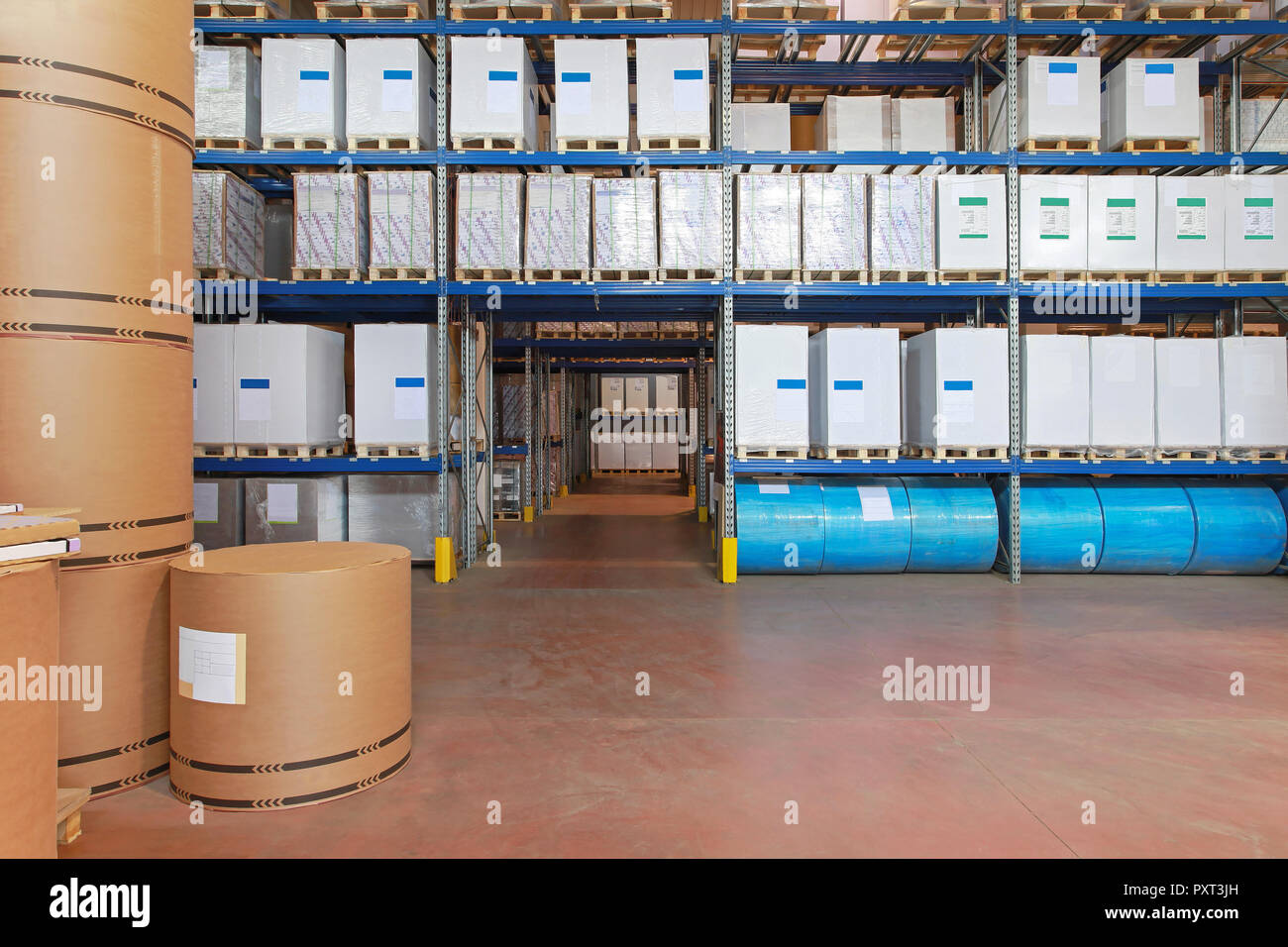 Big warehouse with paper rolls and printing material Stock Photo - Alamy