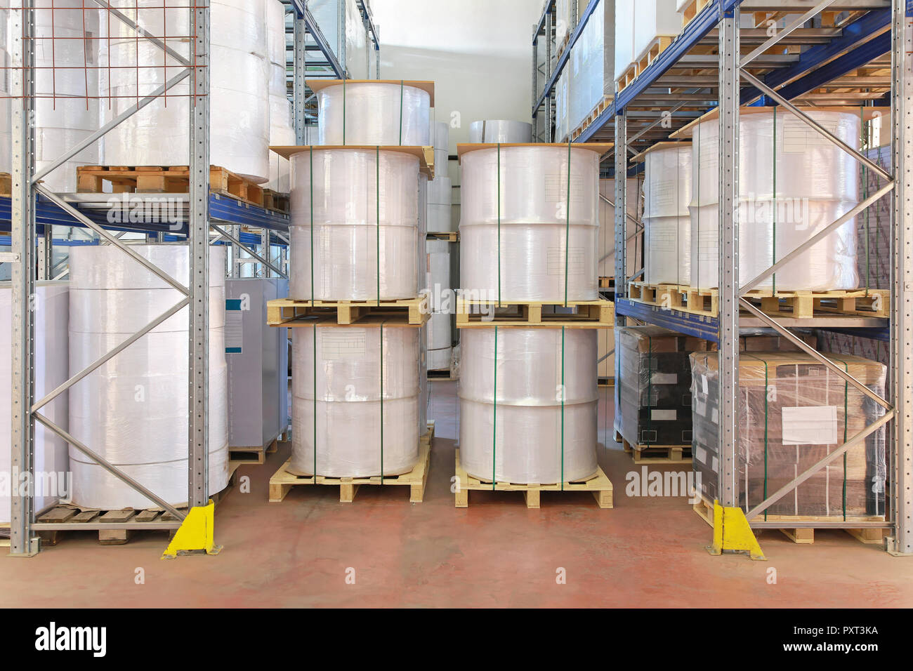 Paper rolls and printing material in warehouse Stock Photo - Alamy