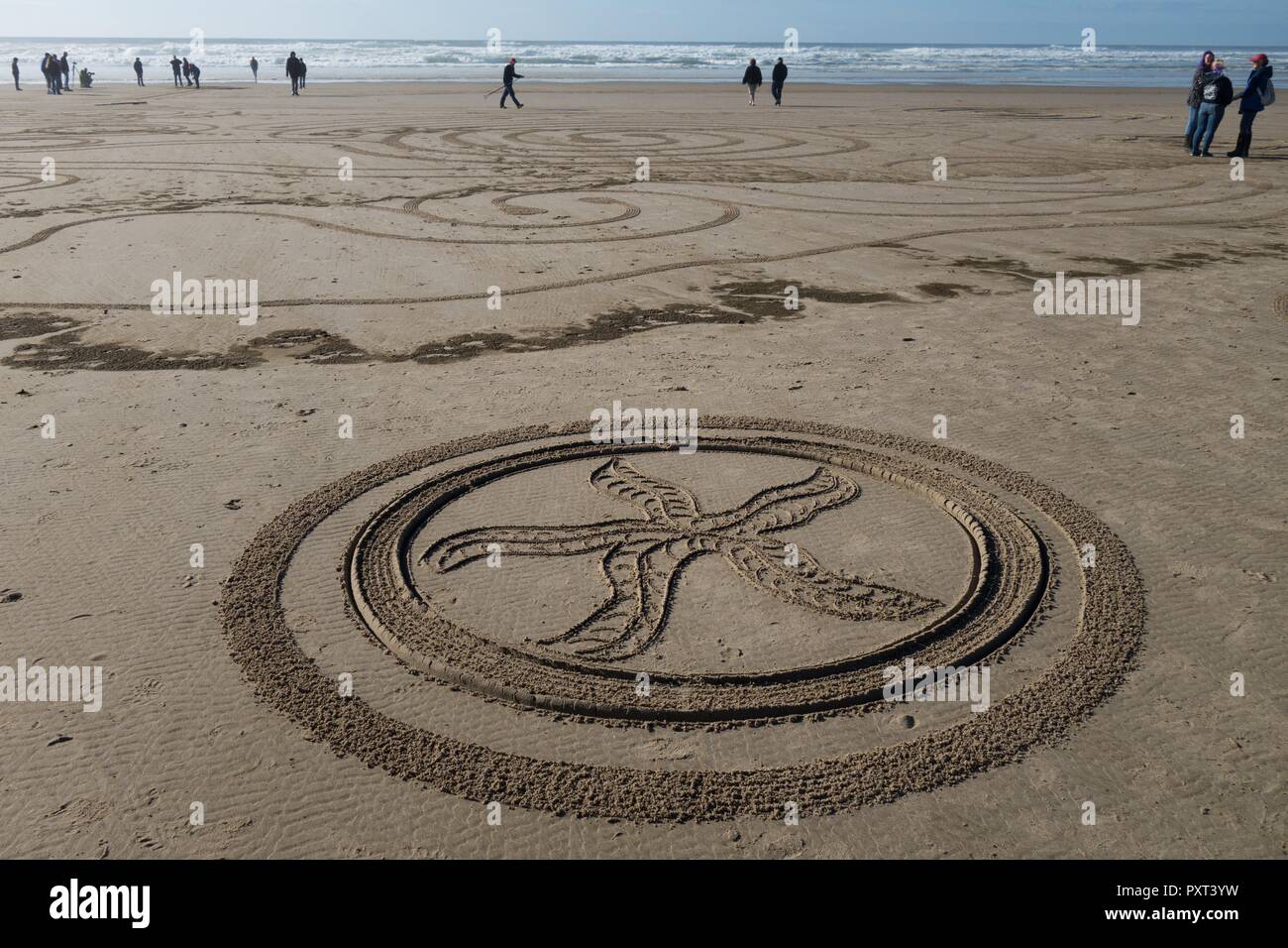 People walking a sand labyrinth, created by Denny Dyke of Circles in ...