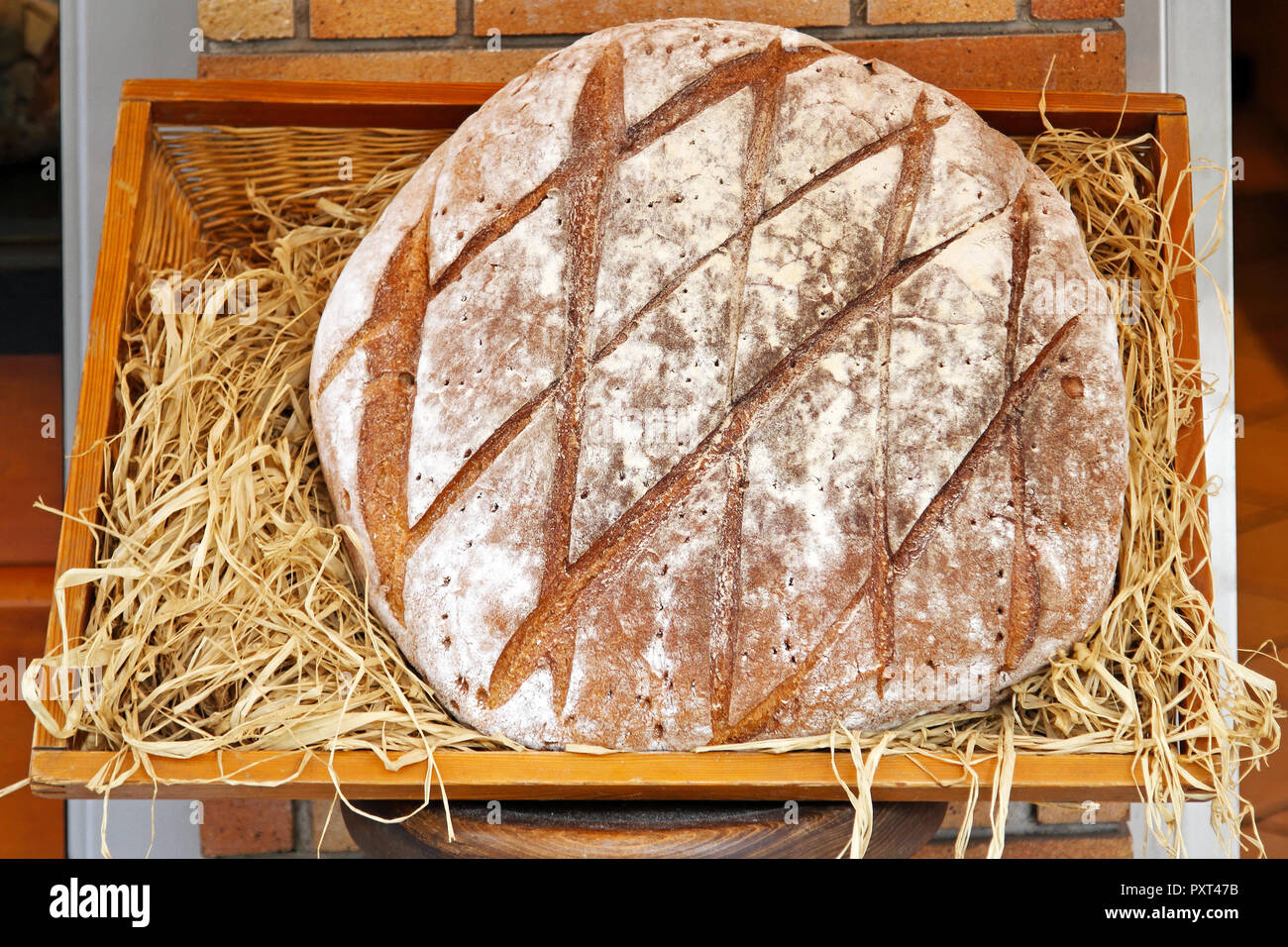 Rustic bread round loaf at bakery window Stock Photo - Alamy