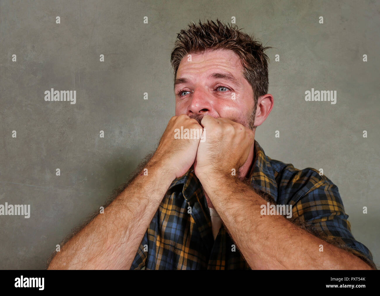 dramatic portrait of young sad and depressed man feeling anxious and ...
