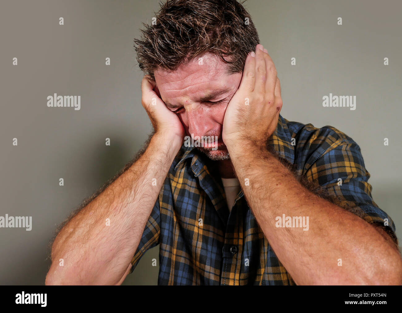 dramatic portrait of young sad and depressed man feeling anxious and ...