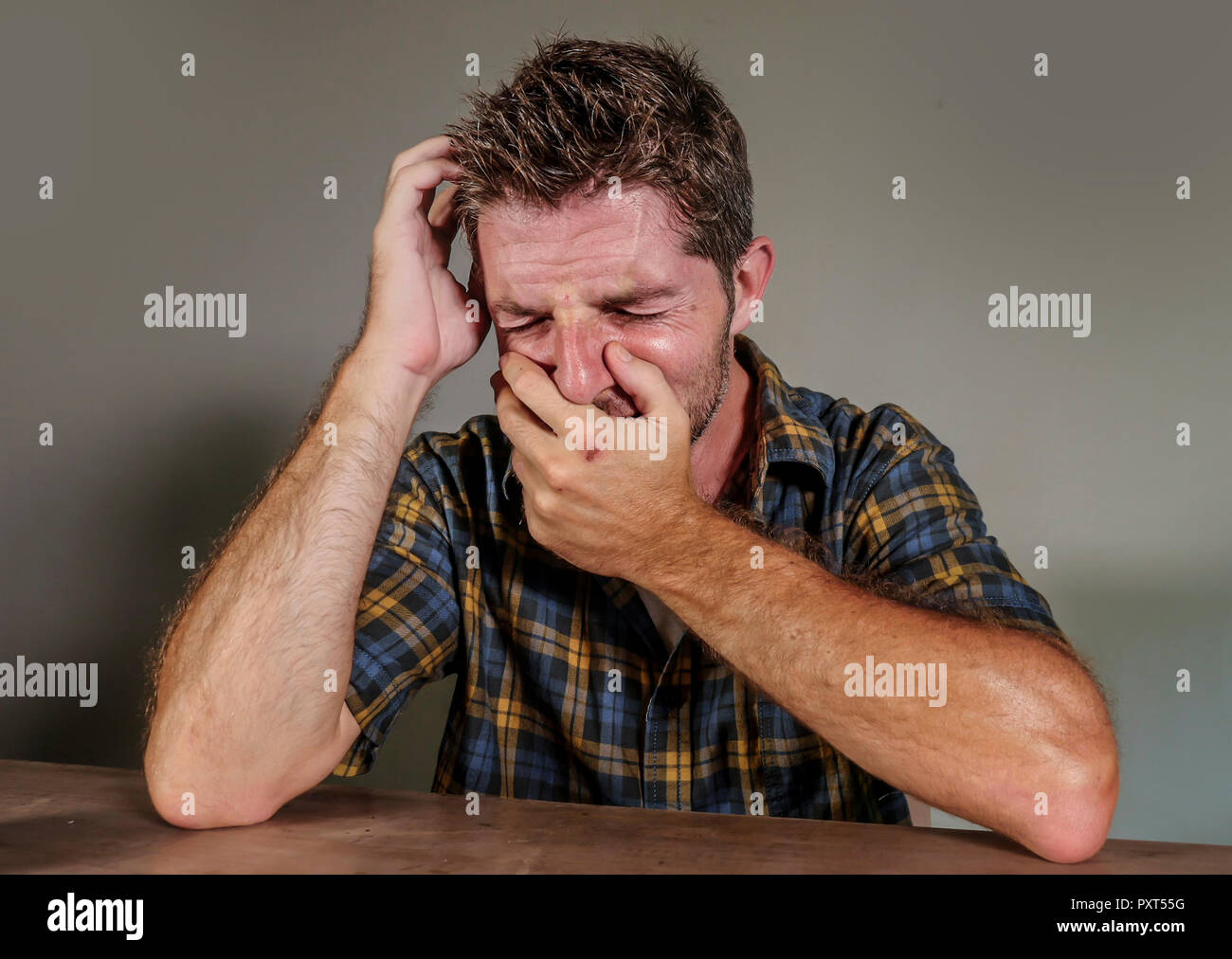 dramatic portrait of young sad and depressed man feeling anxious and ...