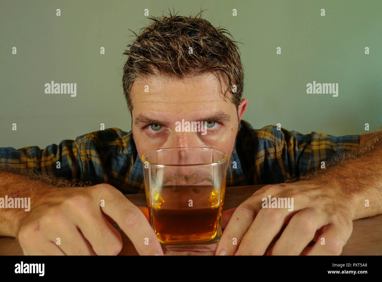 isolated background portrait of wasted and drunk man drinking whiskey ...