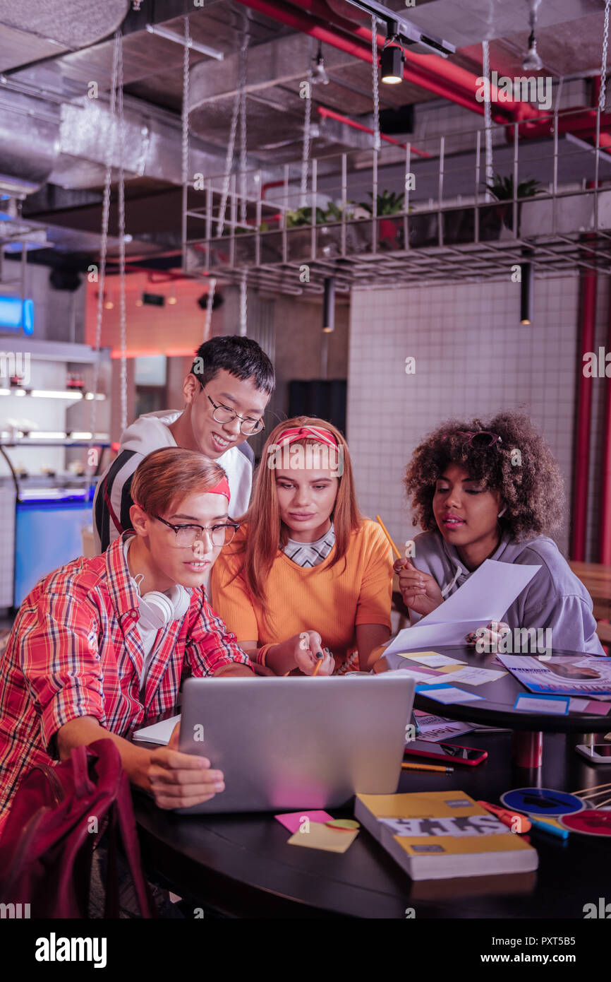 Concentrated classmates completing task together after lessons Stock ...
