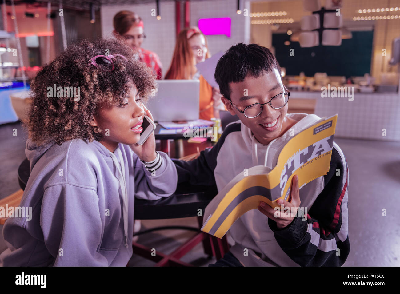 Pleased Asian boy enjoying easy so task Stock Photo - Alamy