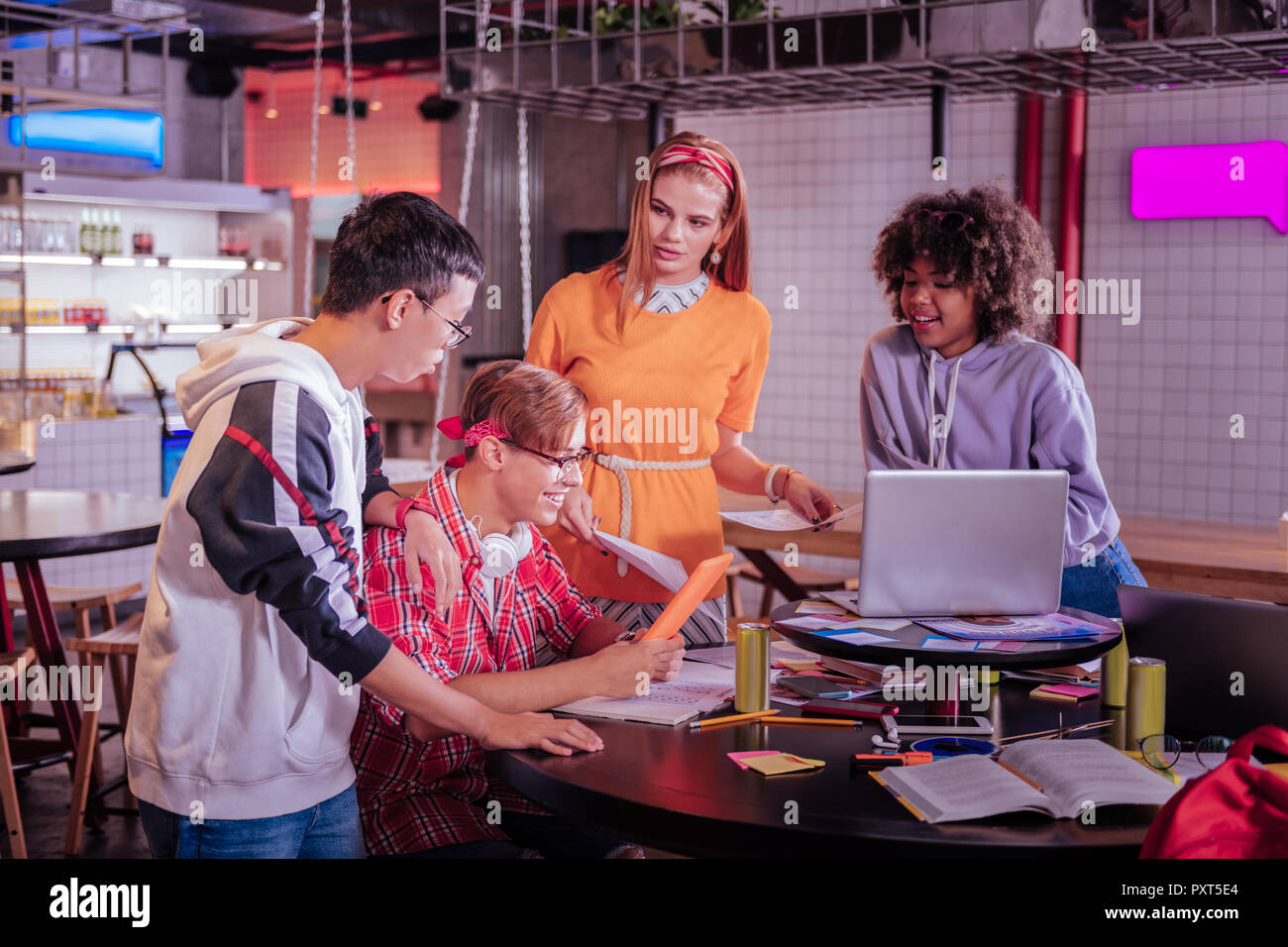 Group of students that discussing their school project Stock Photo - Alamy
