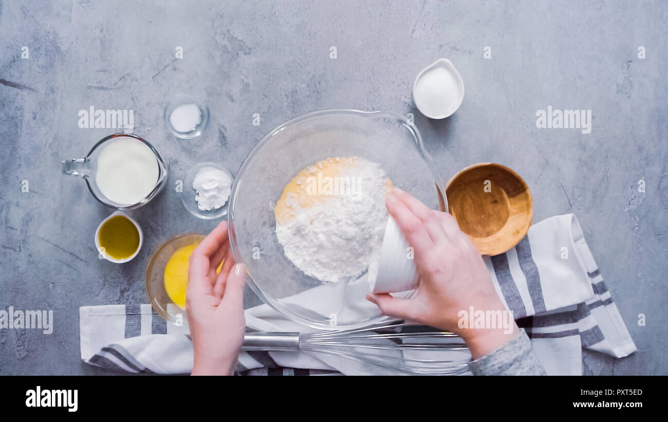 Step by step. Flat lay. Mixing ingredients together in glass mixing ...