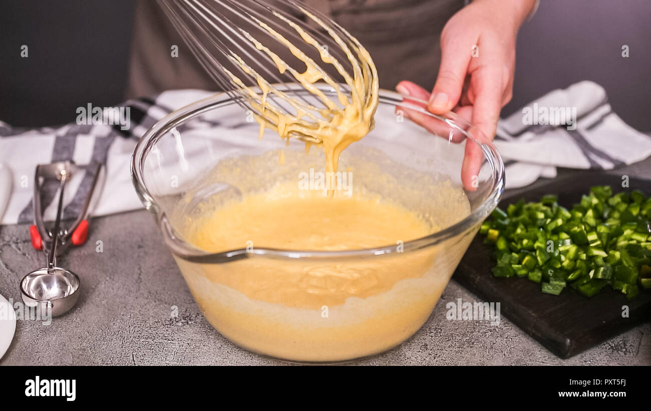 Step by step. Mixing ingredients together in glass mixing bowl for ...
