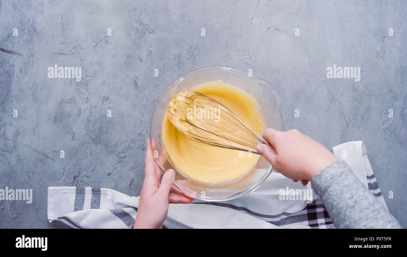 Step by step. Flat lay. Mixing ingredients together in glass mixing ...