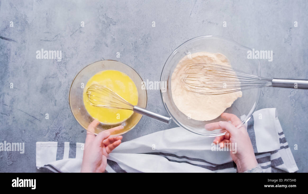 Step by step. Flat lay. Mixing ingredients together in glass mixing ...