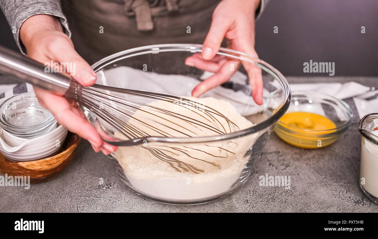 Step by step. Mixing ingredients together in glass mixing bowl for ...
