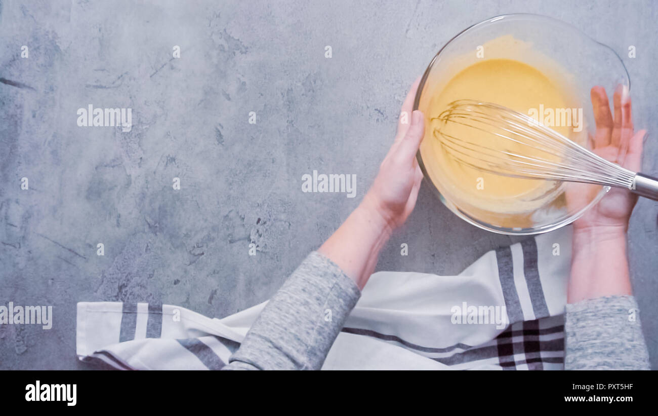 Step by step. Flat lay. Mixing ingredients together in glass mixing ...