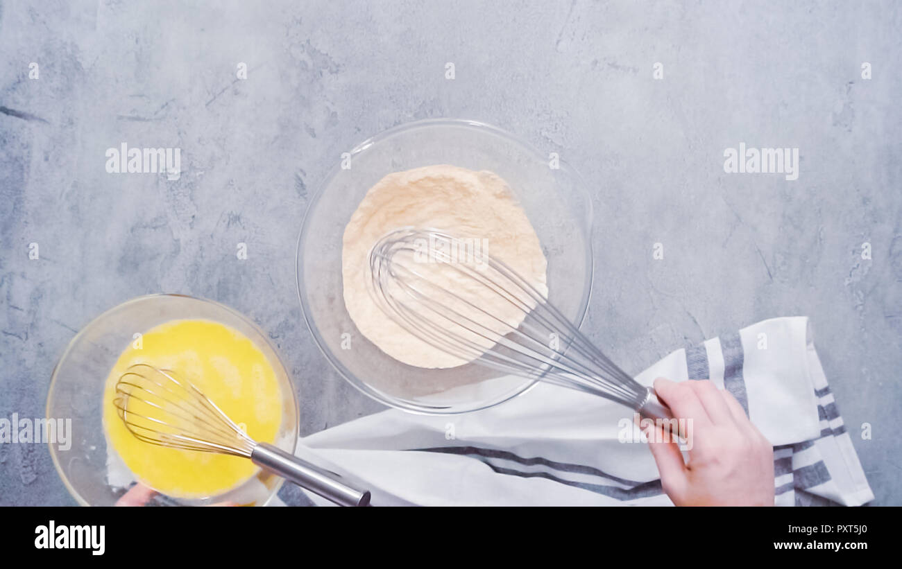 Step by step. Flat lay. Mixing ingredients together in glass mixing ...