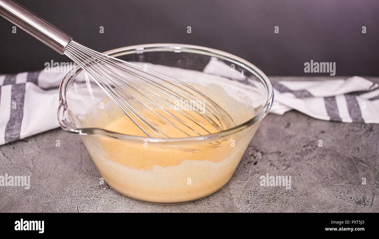 Step by step. Mixing ingredients together in glass mixing bowl for ...