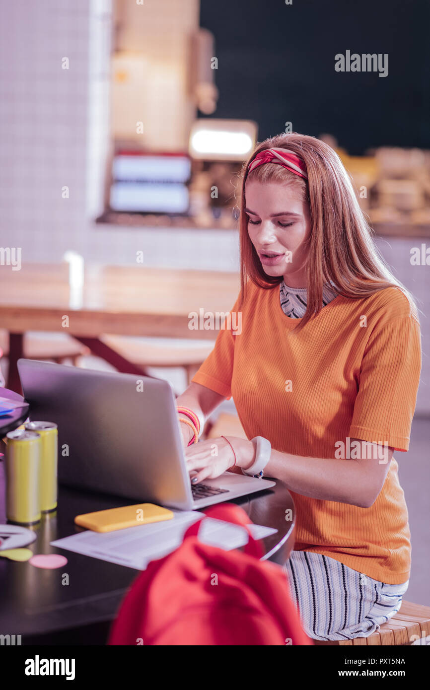 Attentive female person completing task very conscious Stock Photo - Alamy