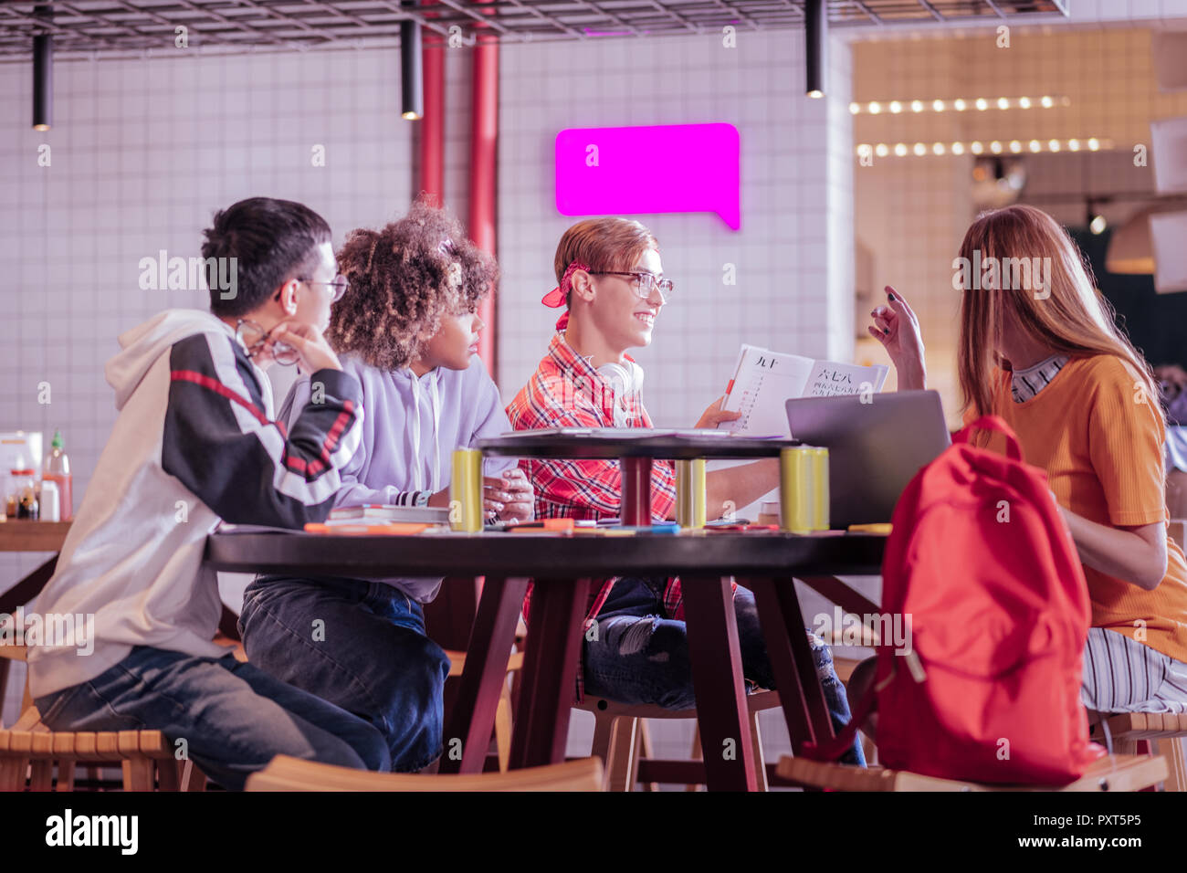 Group of students discussing their task for presentation Stock Photo ...