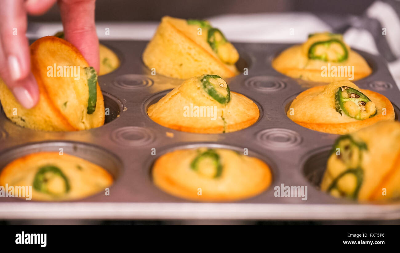 Step by step. Taking out freshly baked spicy jalapeno cornbread muffins ...