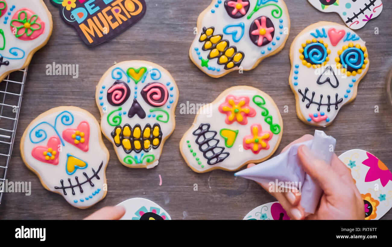 Step by step. Flat lay. Decorating sugar skull cookies with different ...