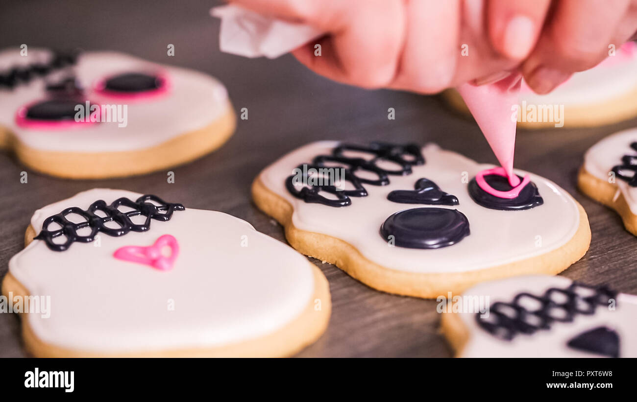 Step by step. Decorating sugar skull cookies with different color royal ...