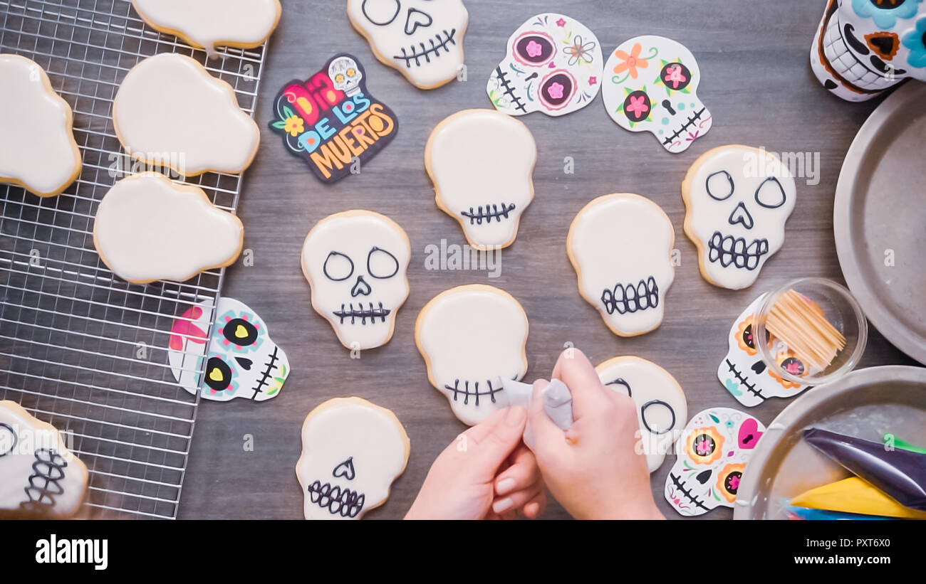 Step by step. Flat lay. Decorating sugar skull cookies with different ...