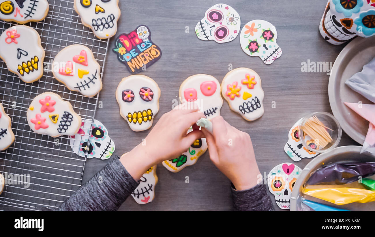Step by step. Flat lay. Decorating sugar skull cookies with different ...
