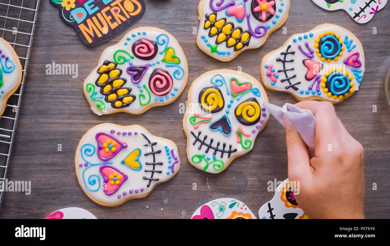 Step by step. Flat lay. Decorating sugar skull cookies with different ...