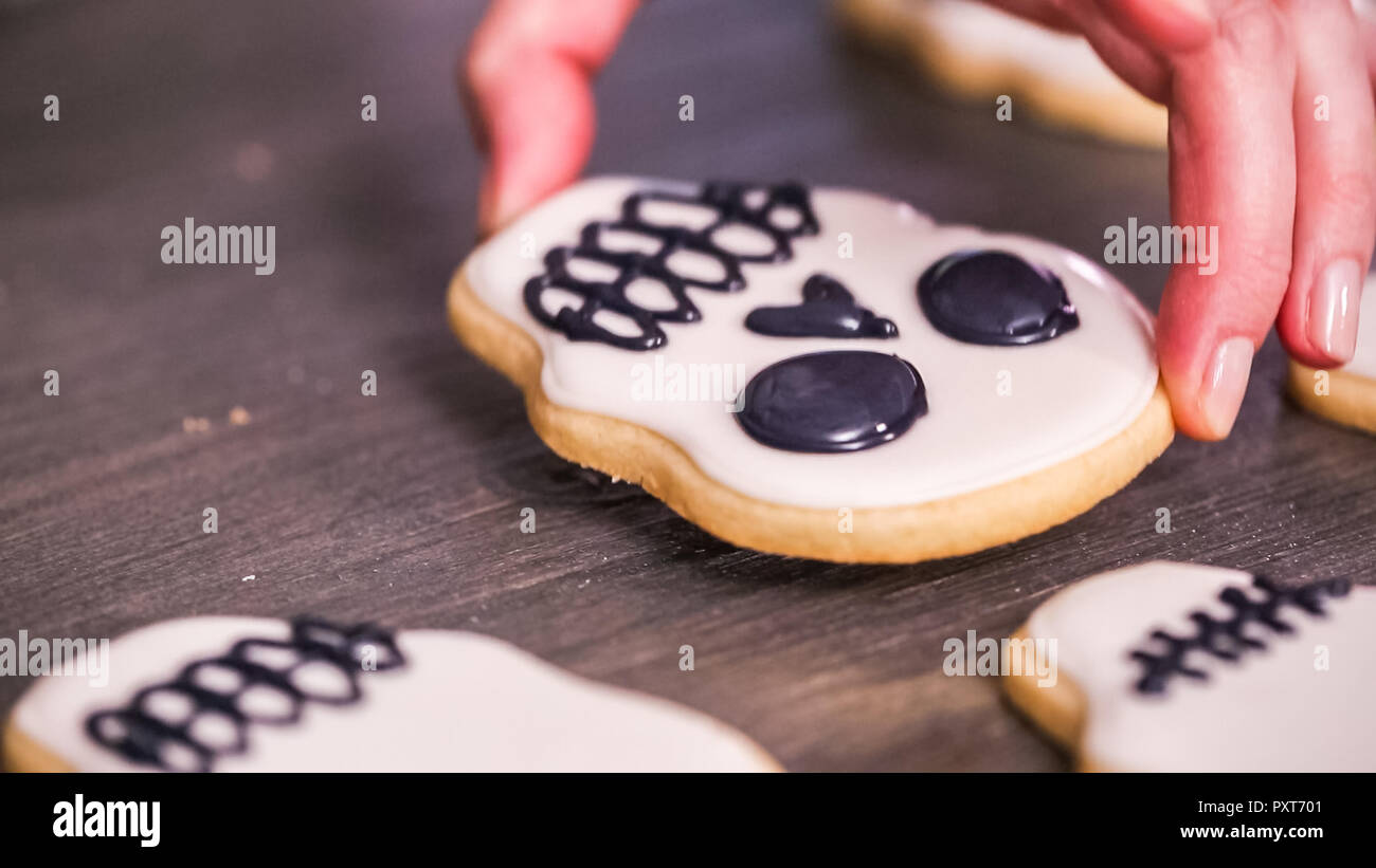Step by step. Decorating sugar skull cookies with different color royal ...