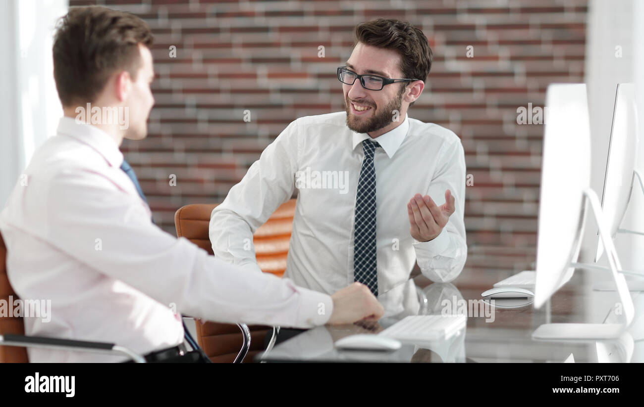 Manager talking with a colleague Stock Photo - Alamy