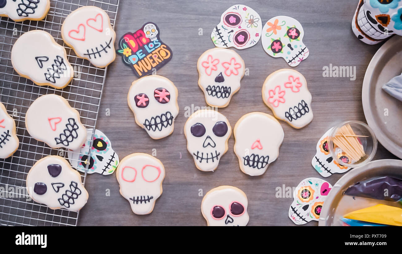 Step by step. Flat lay. Decorating sugar skull cookies with different ...