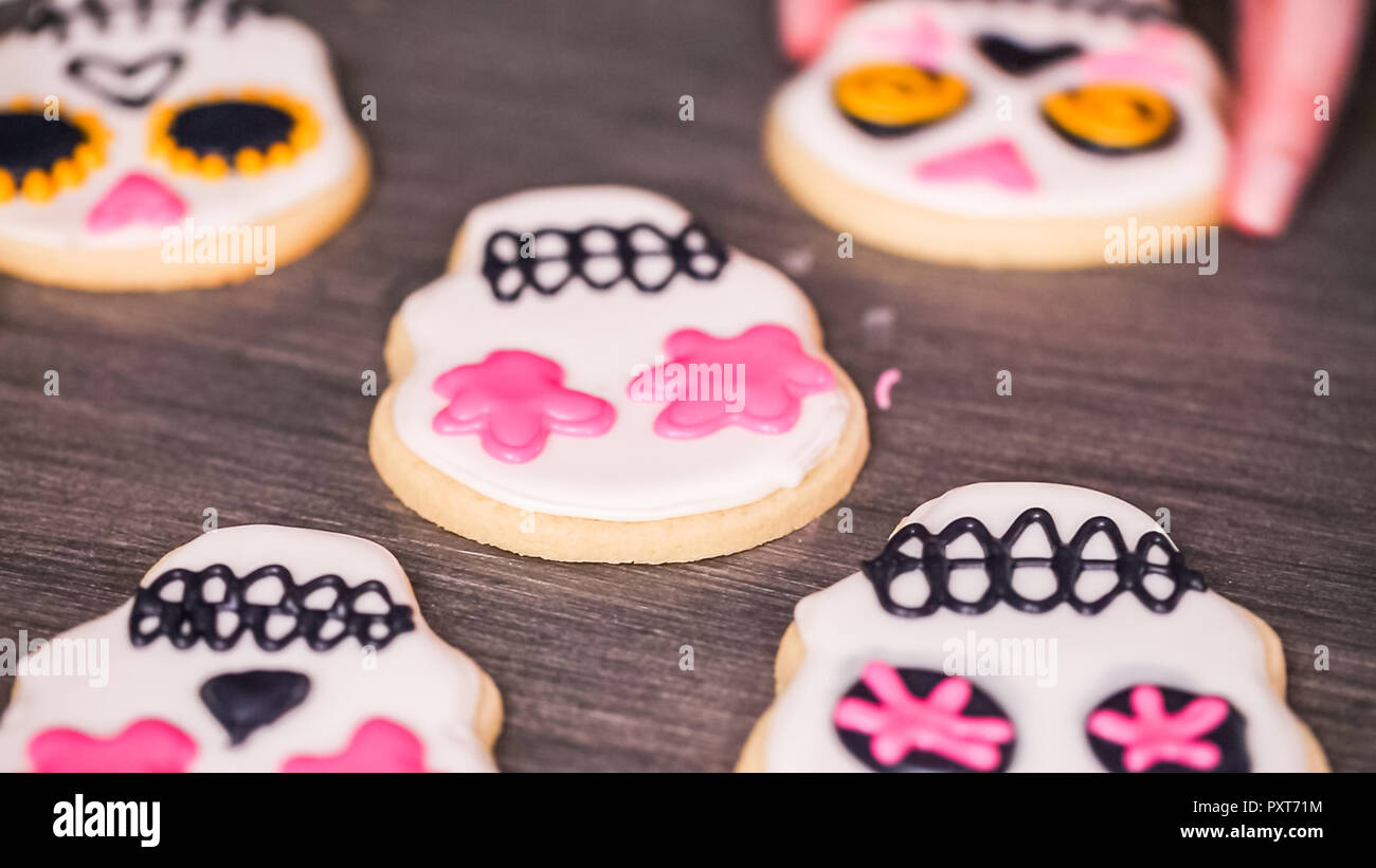 Step by step. Decorating sugar skull cookies with different color royal ...