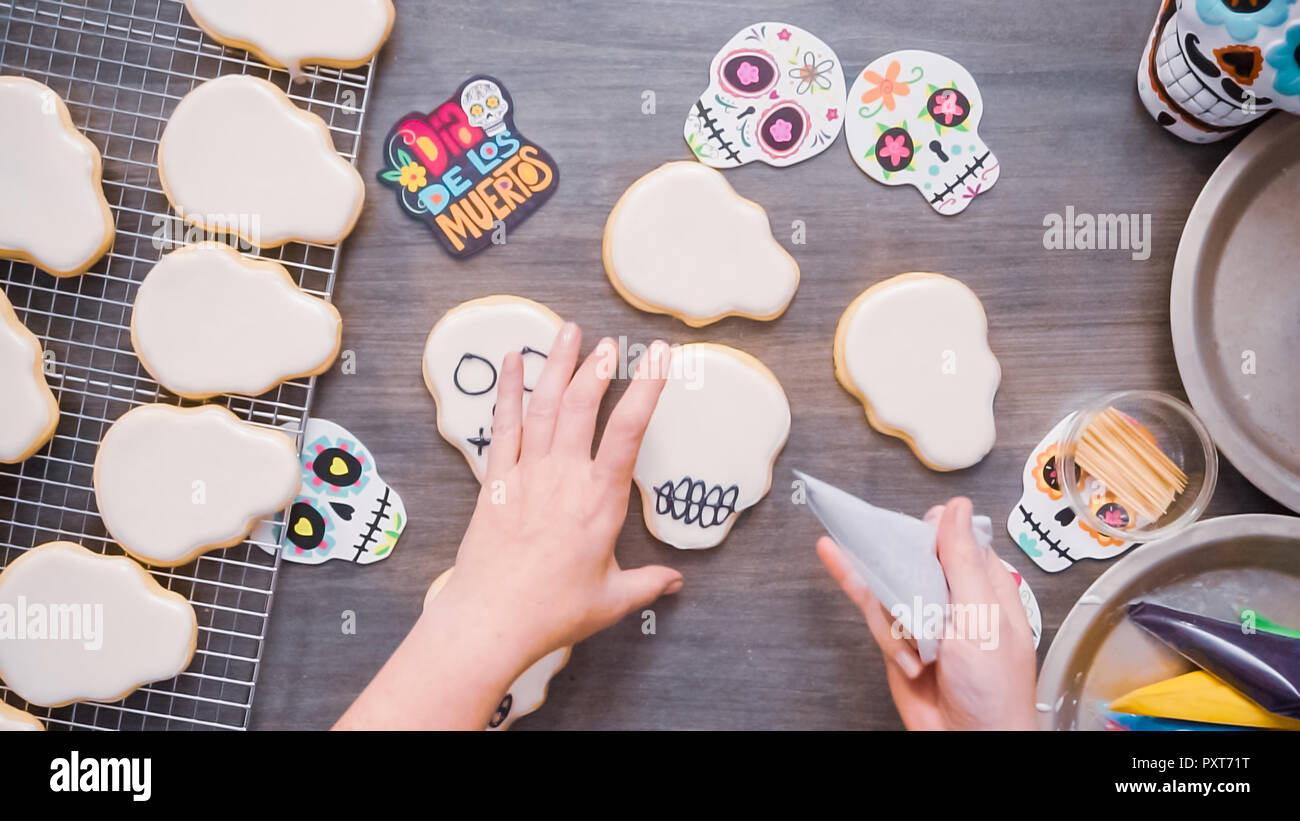 Step by step. Flat lay. Decorating sugar skull cookies with different ...
