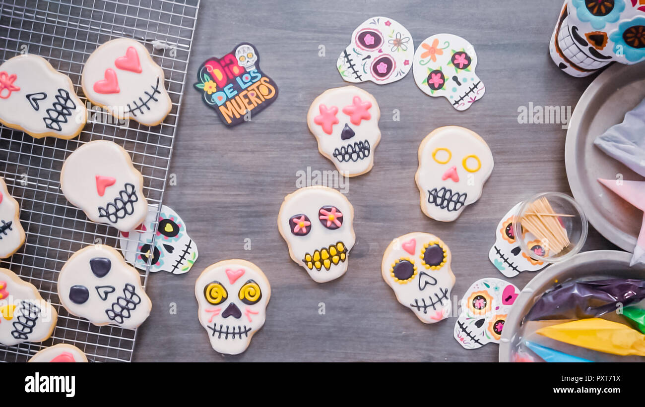 Step by step. Flat lay. Decorating sugar skull cookies with different ...