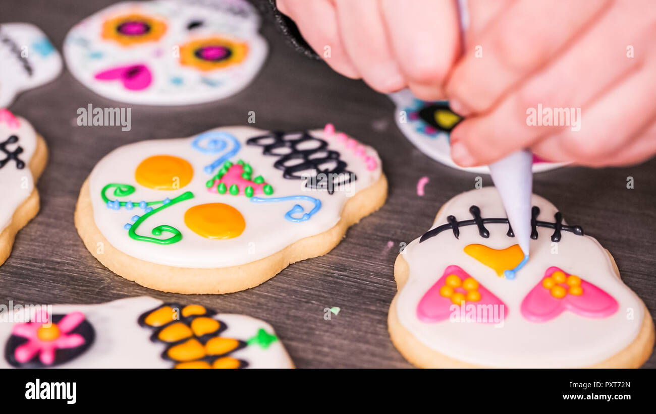Step by step. Decorating sugar skull cookies with different color royal ...