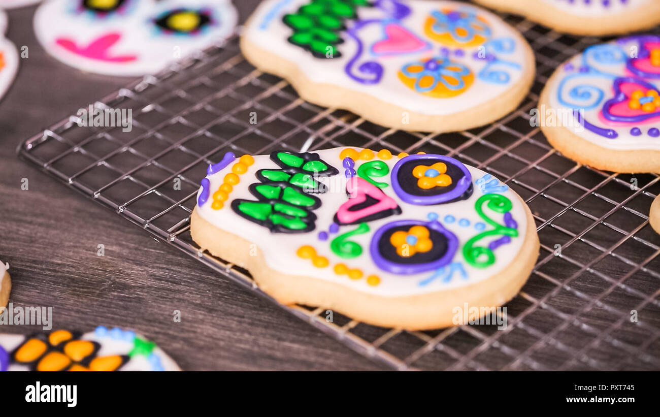 Step by step. Decorating sugar skull cookies with different color royal ...