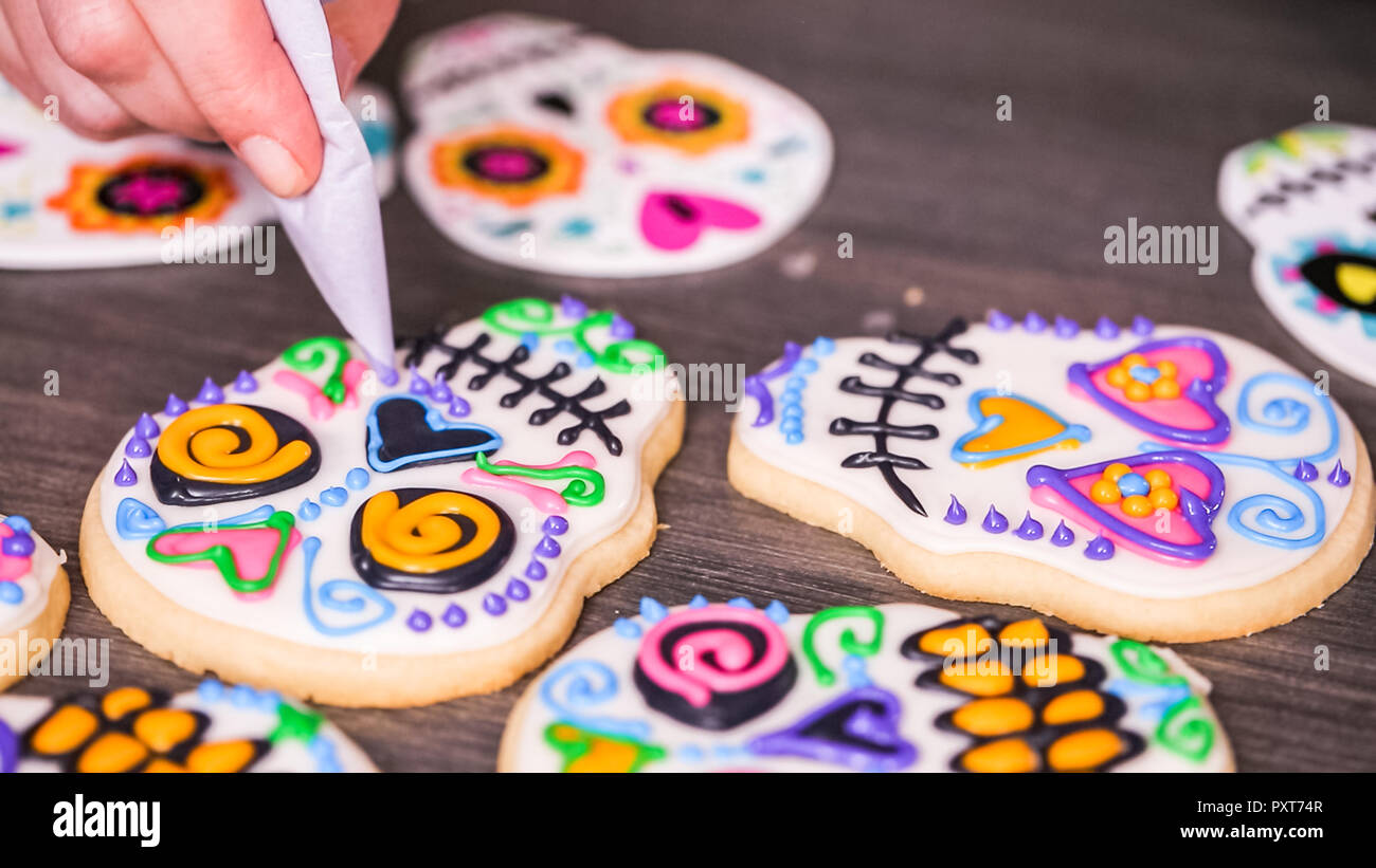 Step by step. Decorating sugar skull cookies with different color royal ...