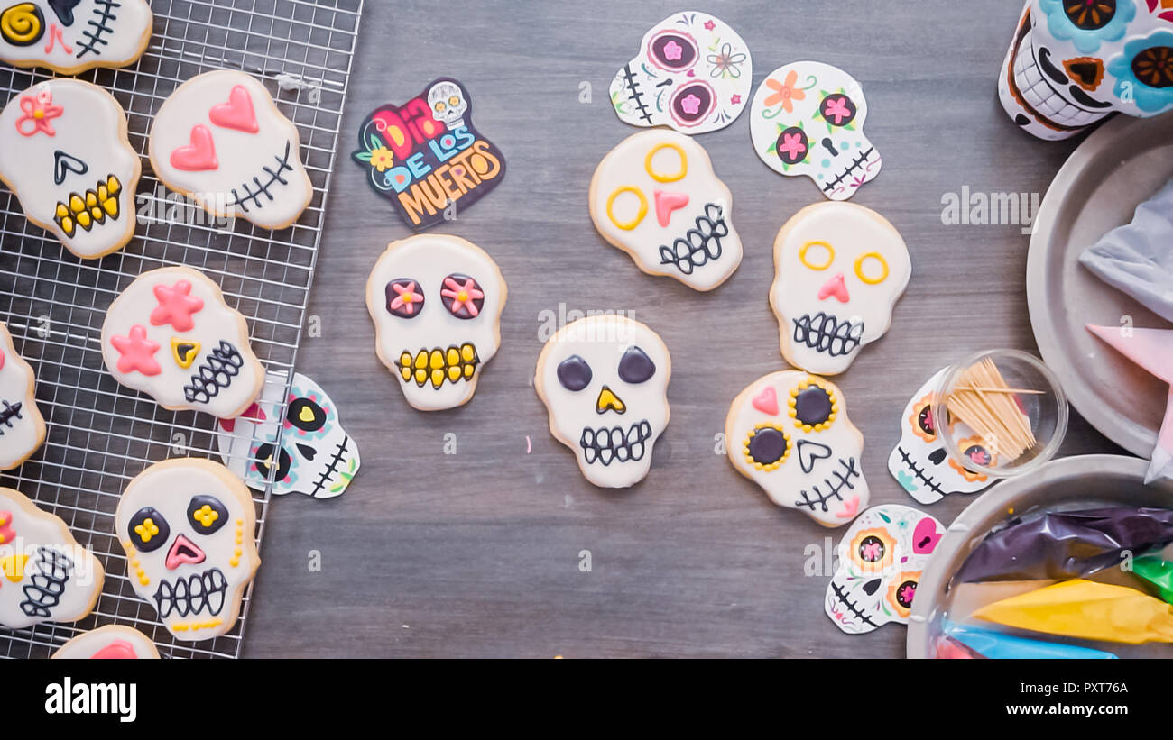 Step by step. Flat lay. Decorating sugar skull cookies with different ...