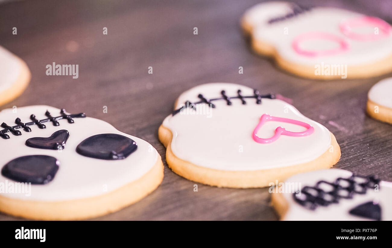 Step by step. Decorating sugar skull cookies with different color royal ...