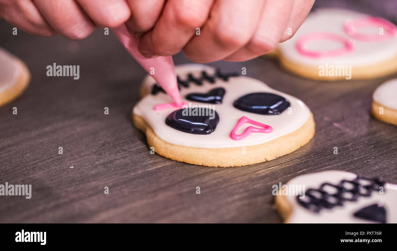 Step by step. Decorating sugar skull cookies with different color royal ...
