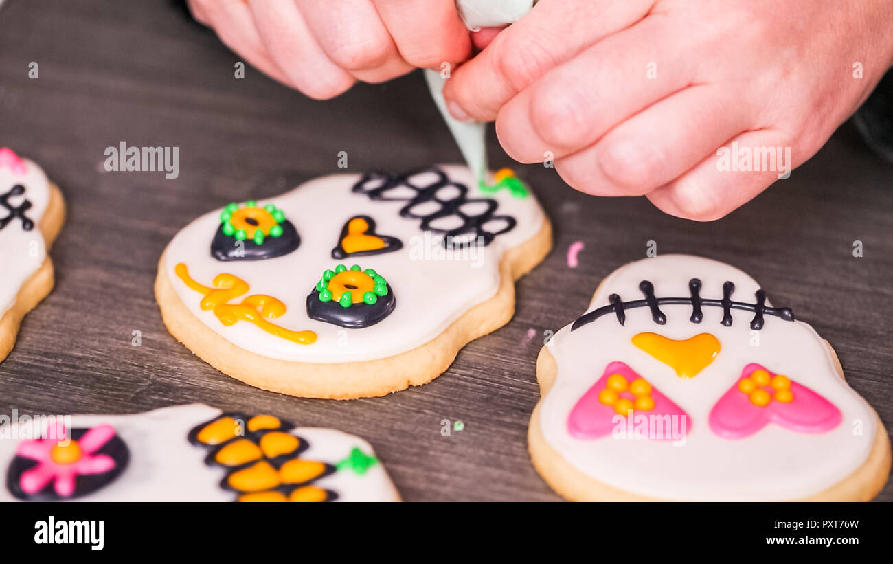Step by step. Decorating sugar skull cookies with different color royal ...