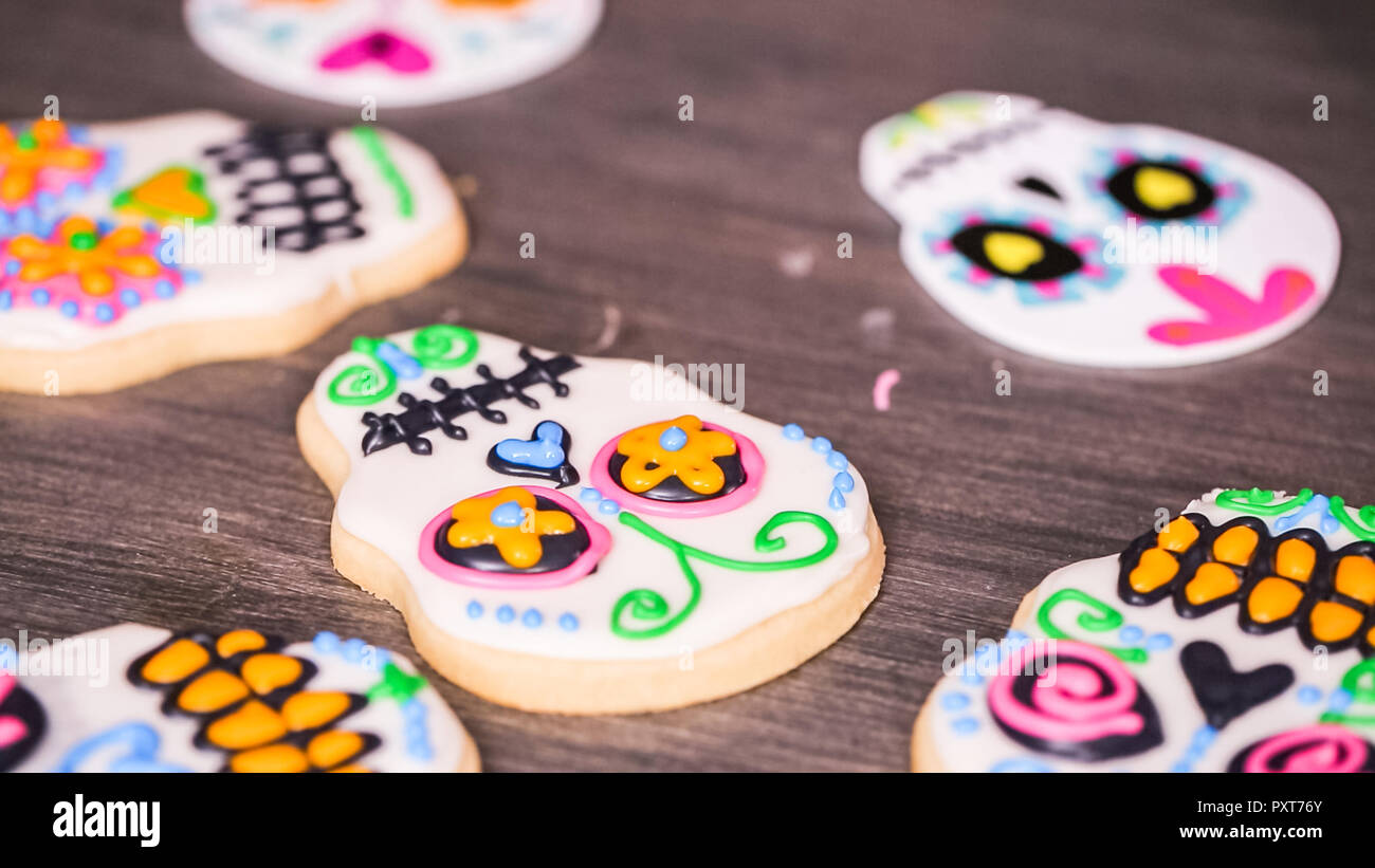 Step by step. Decorating sugar skull cookies with different color royal ...