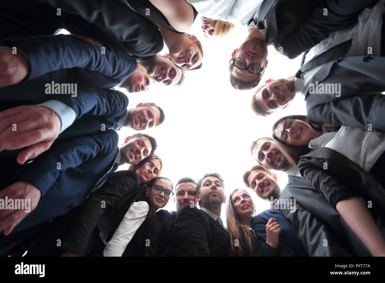 large business team is forming a circle and looking at the camera Stock ...