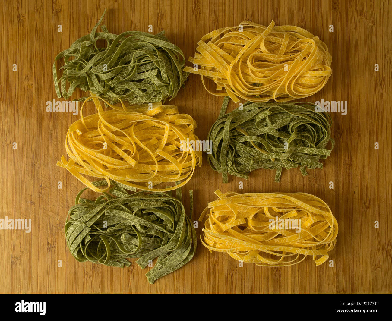 Dried tagliatelle pasta nests hi-res stock photography and images - Alamy