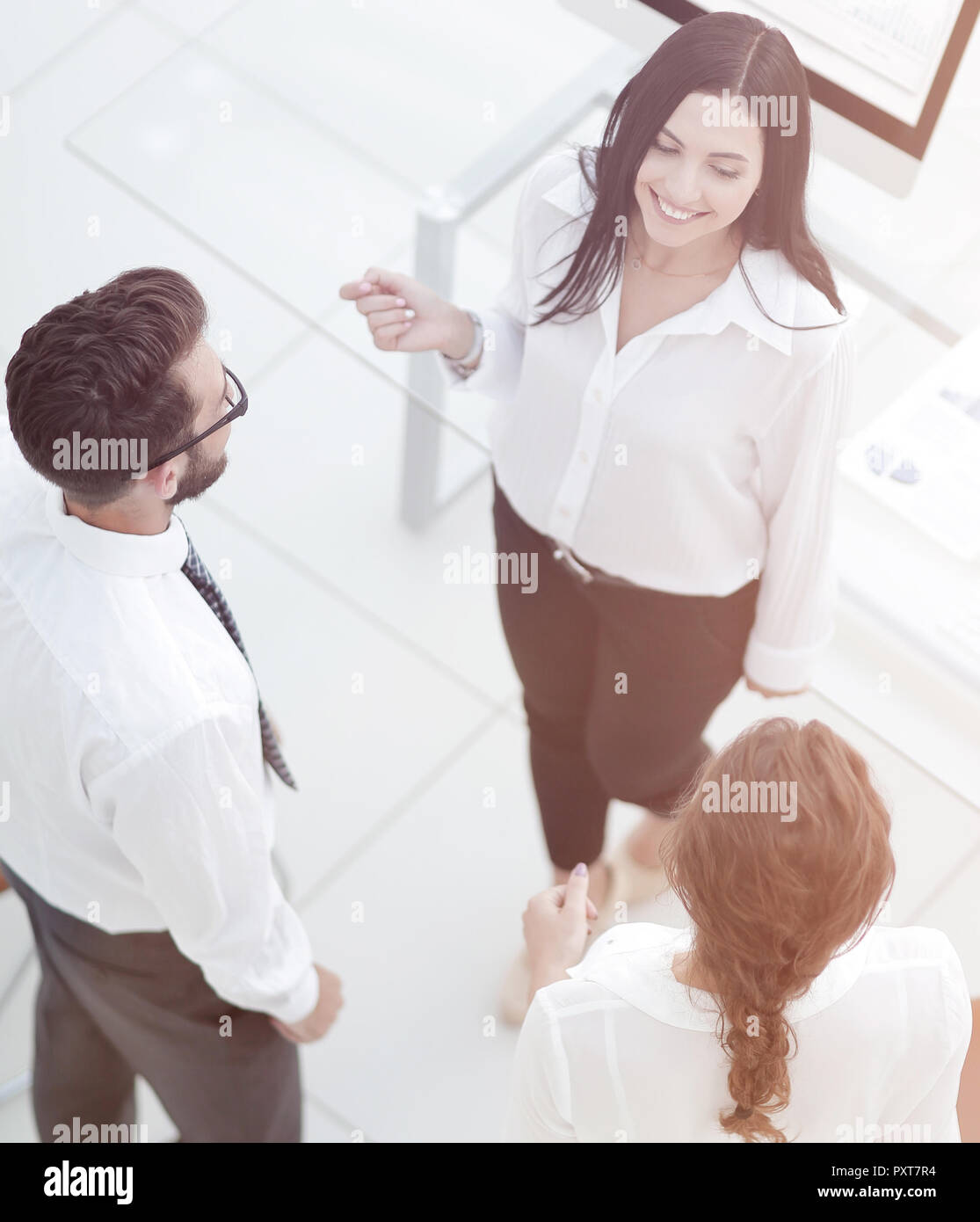 company employees are talking in the office Stock Photo - Alamy